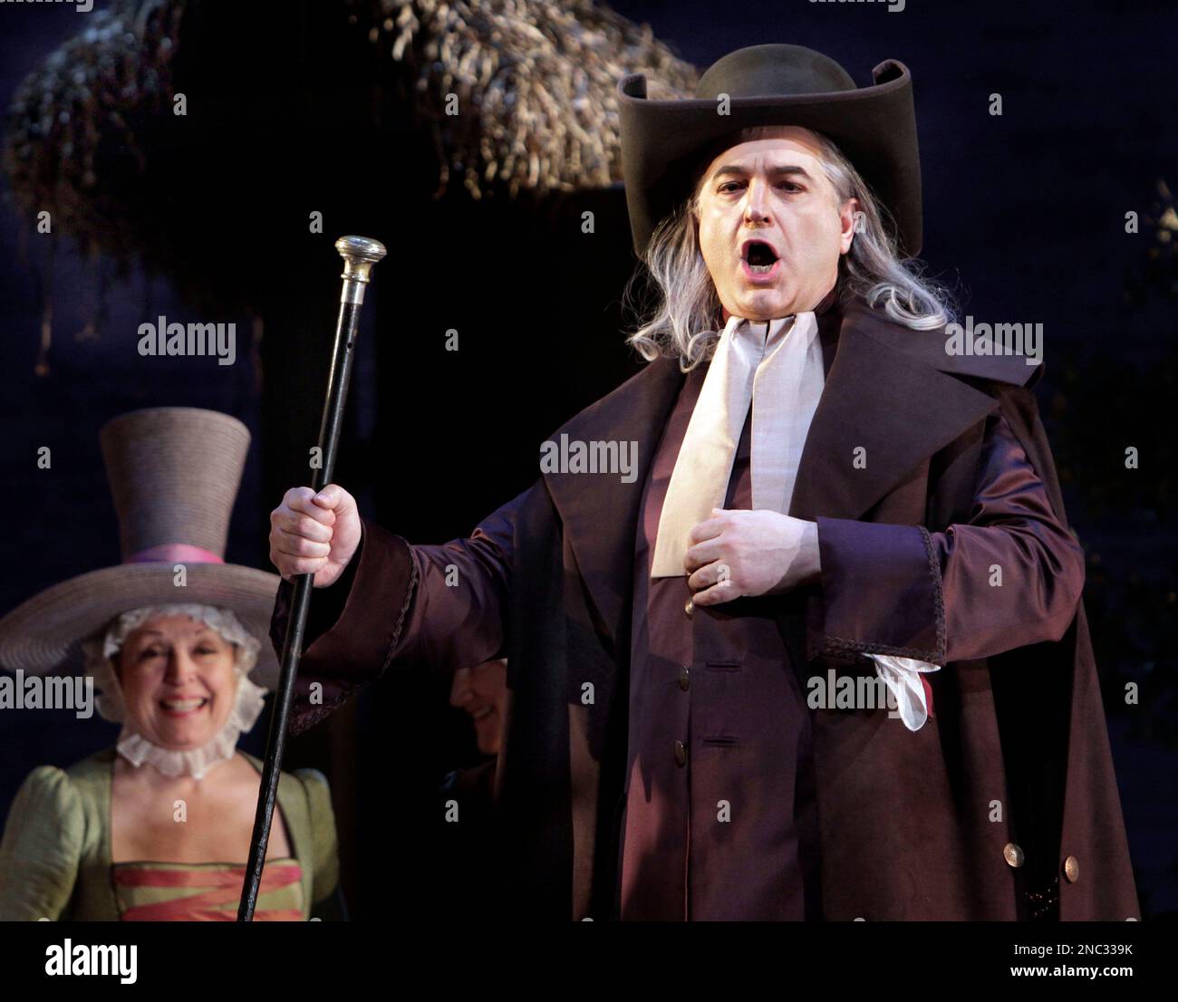 In this March 21, 2011 photo, Michele Pertusi, right, as The Tutor, is ...