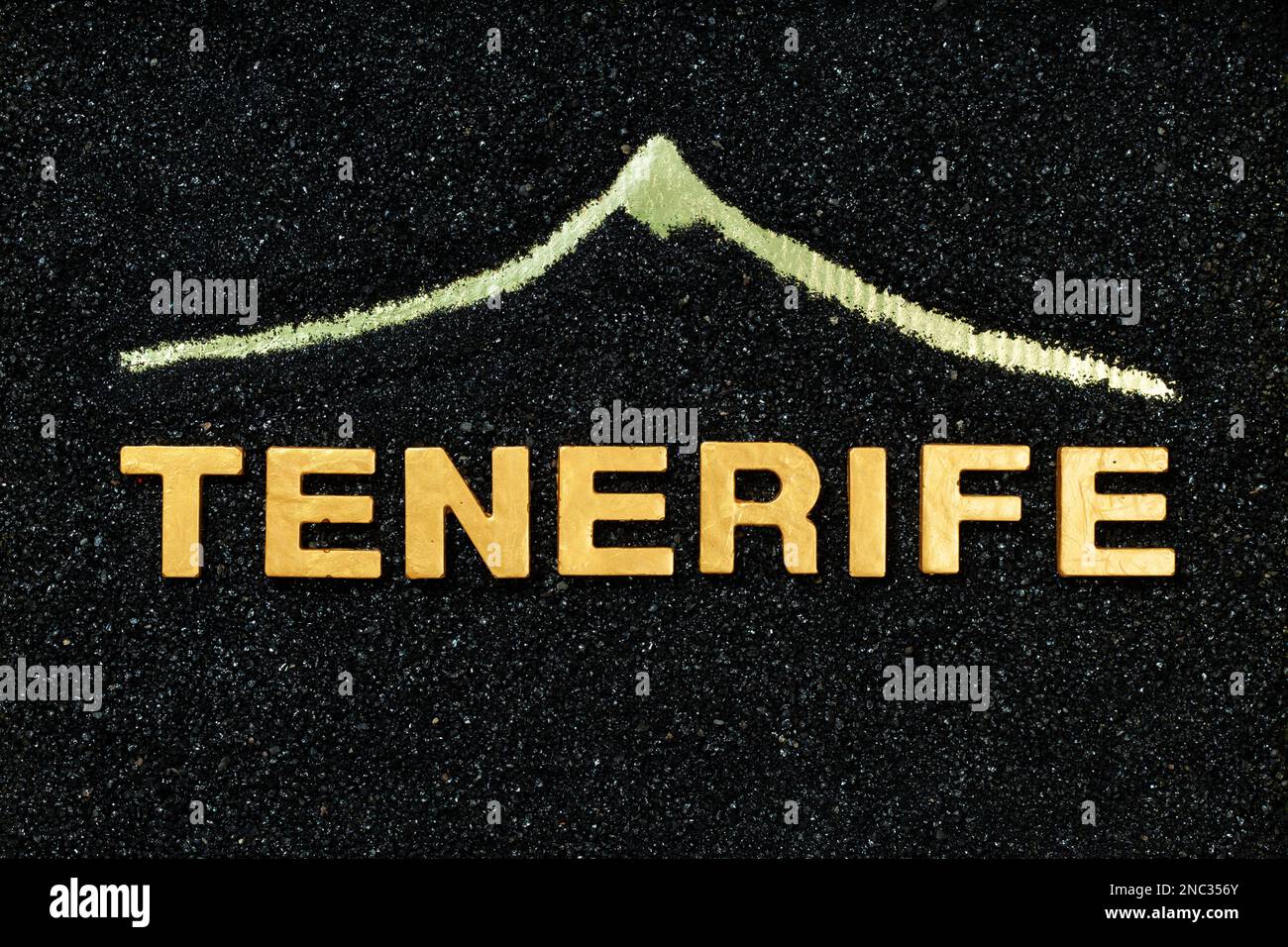 Tenerife - Golden letters in black sand Stock Photo - Alamy