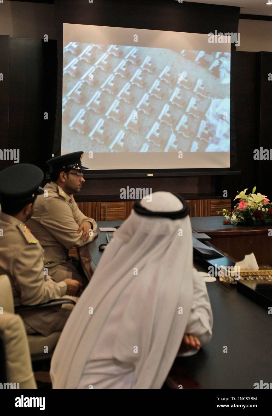 Dubai's police employees watch footage of a seized shipment during a ...