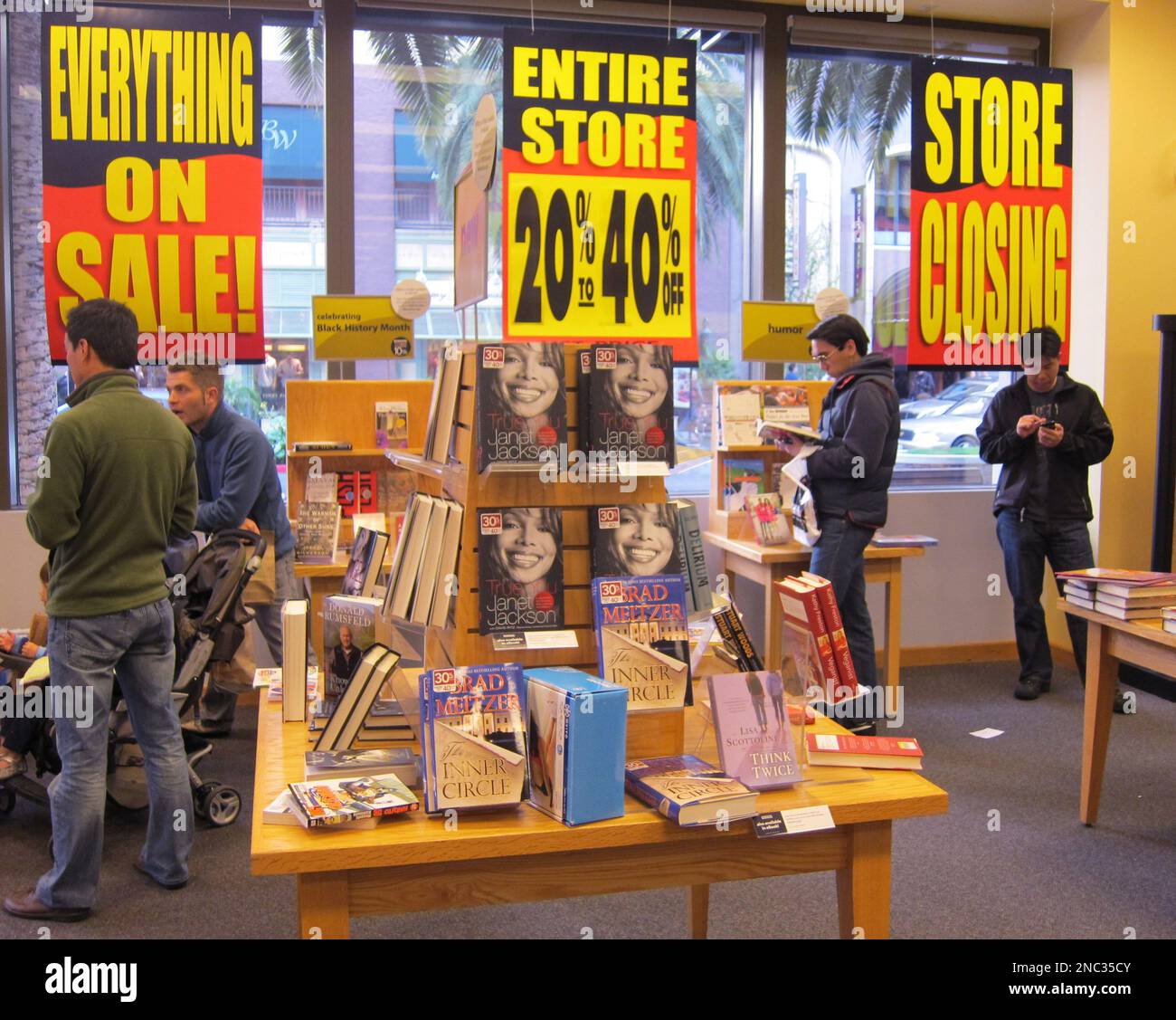 In this Feb. 20, 2011 photo, customers look for books during a ...