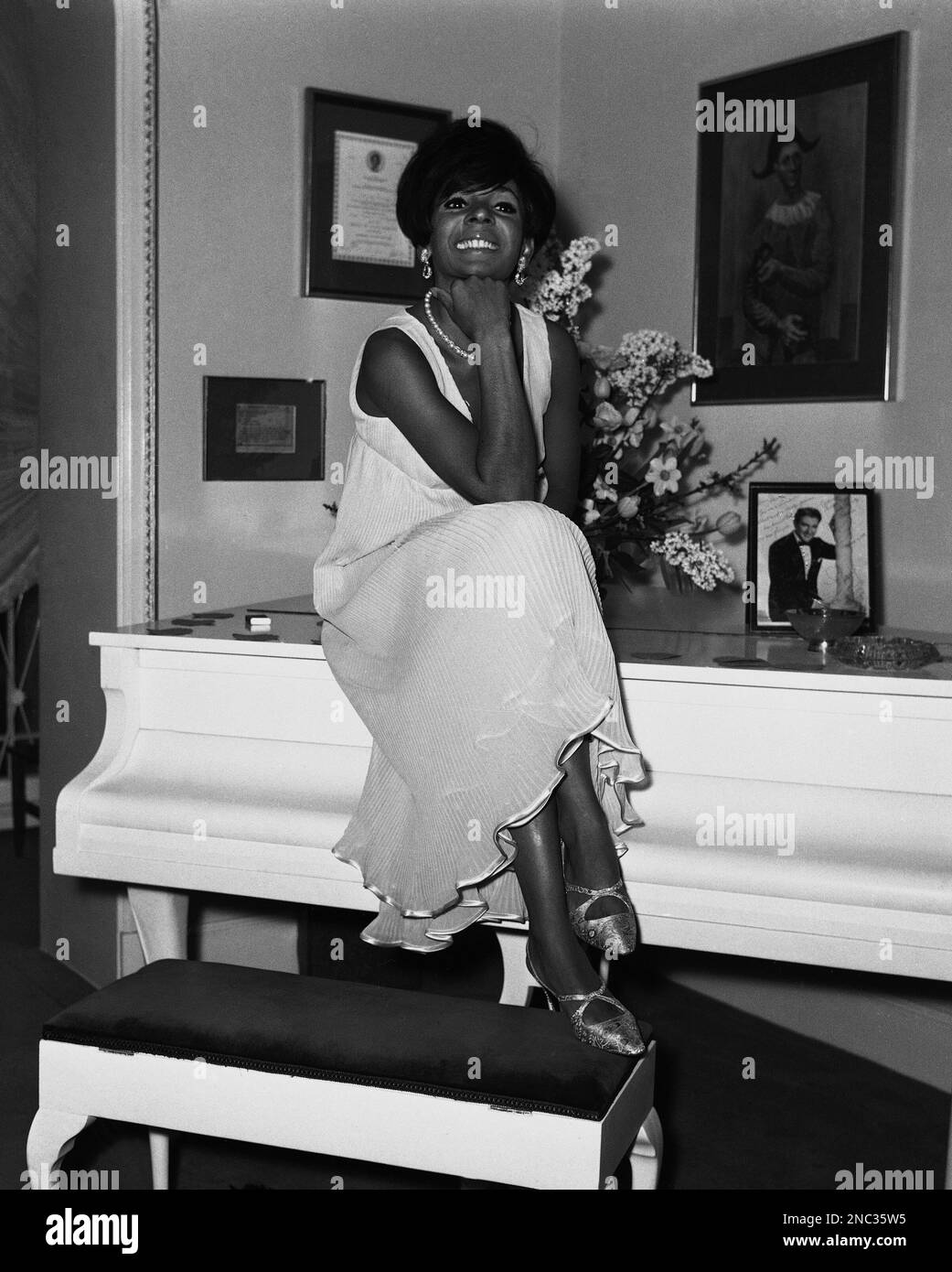 Singer Shirley Bassey smiles as she poses for photographers after ...