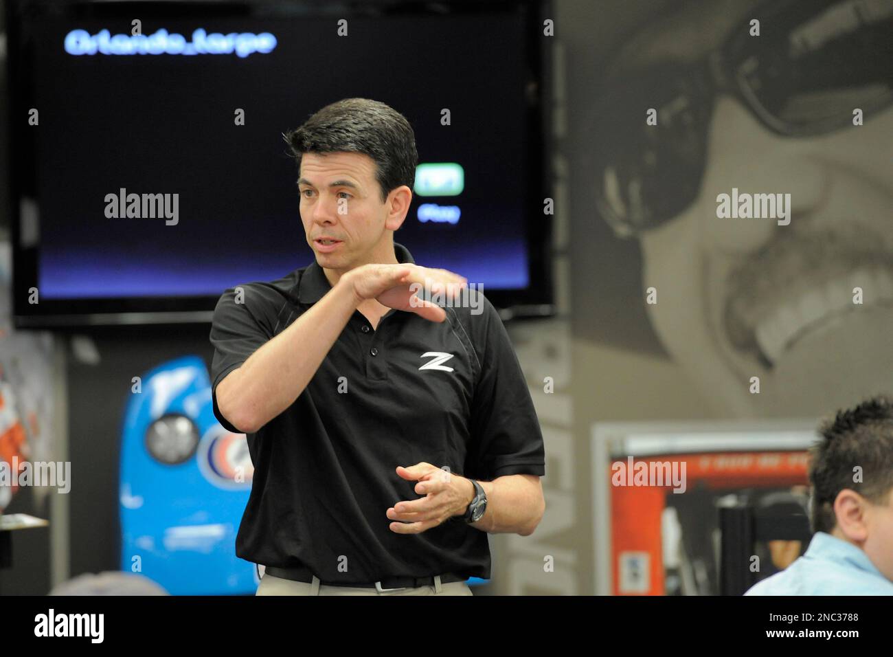 Nissan's Colin Price speaks to media members prior to a media driving ...