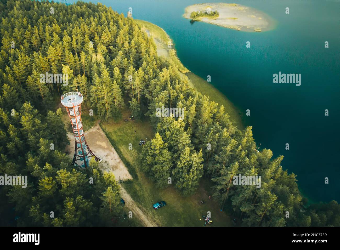 Labanoras" watch tower from aerial perspective with lake in the ...