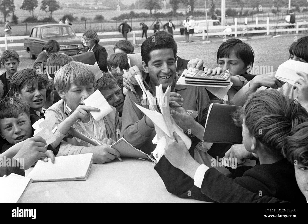 Uruguay soccer star Hector Silva laughs as he is mobbed by young ...
