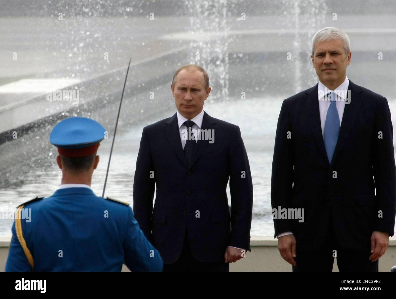 Russia's Prime Minister Vladimir Putin, center, reviews guard of honor ...