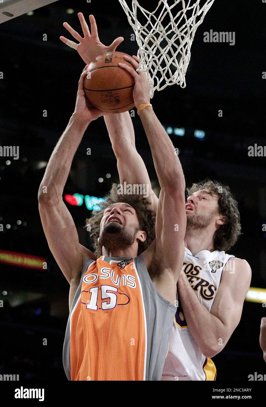 Phoenix Suns center Robin Lopez, left, works against Los Angeles Lakers ...