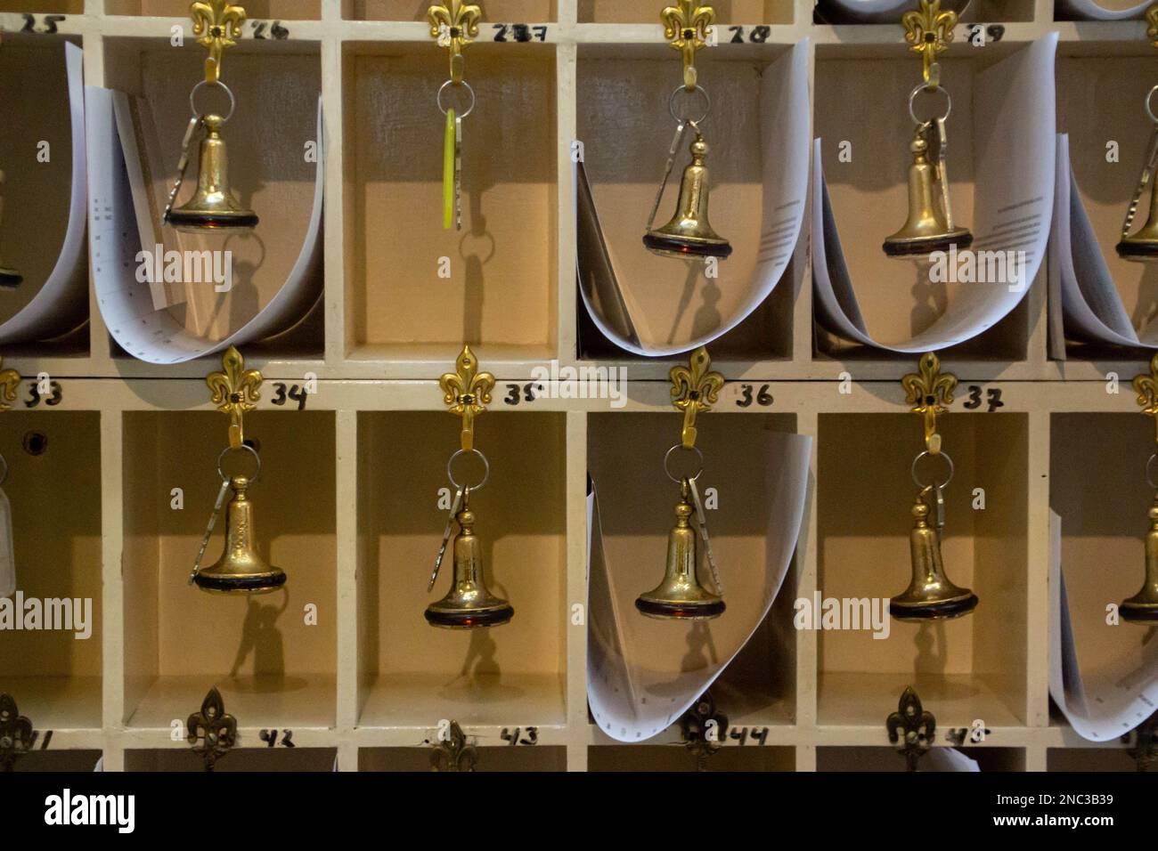 An organized row of display cases are filled with various awards ...