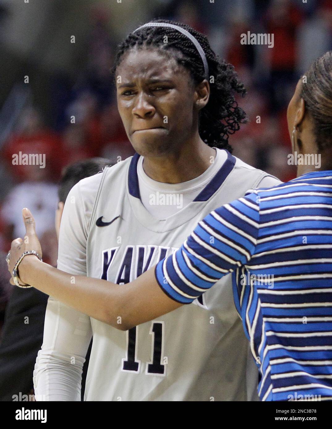 Xavier forward Amber Harris (11) walks off the floor after Xavier's 85 ...