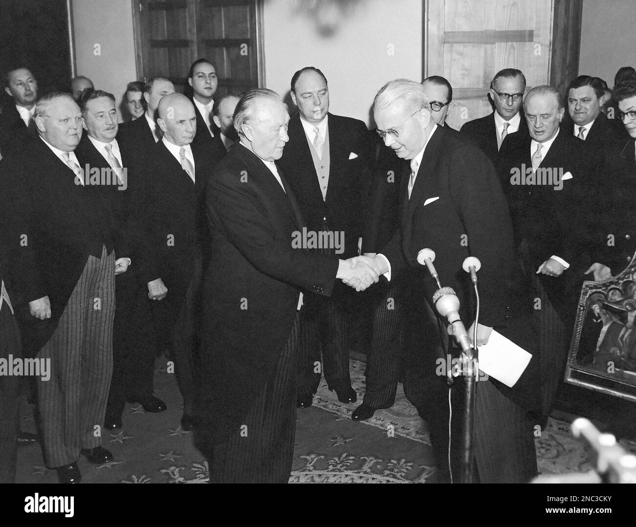 West German Chancellor Konrad Adenauer, center, is congratulated on his ...