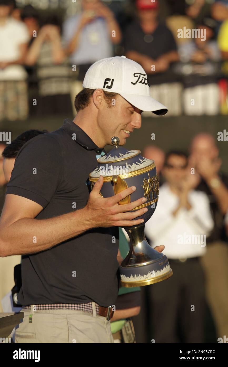 Nick Watney poses with the trophy after winning during the Cadillac ...
