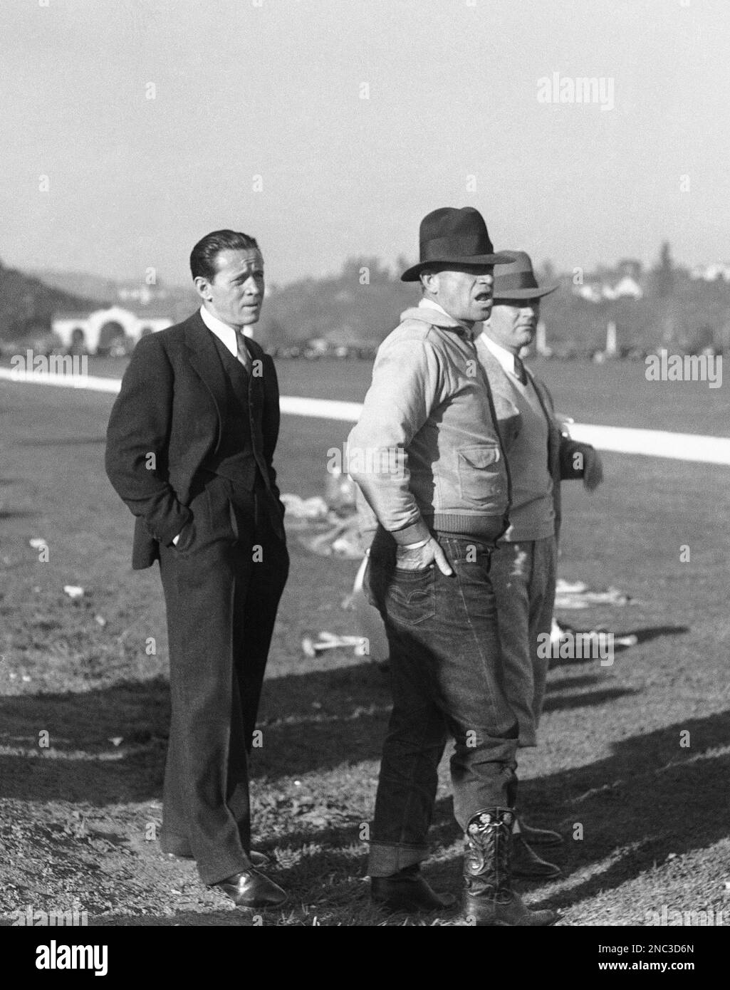 The informally garbed man in the center is Will Rogers, the cowboy ...