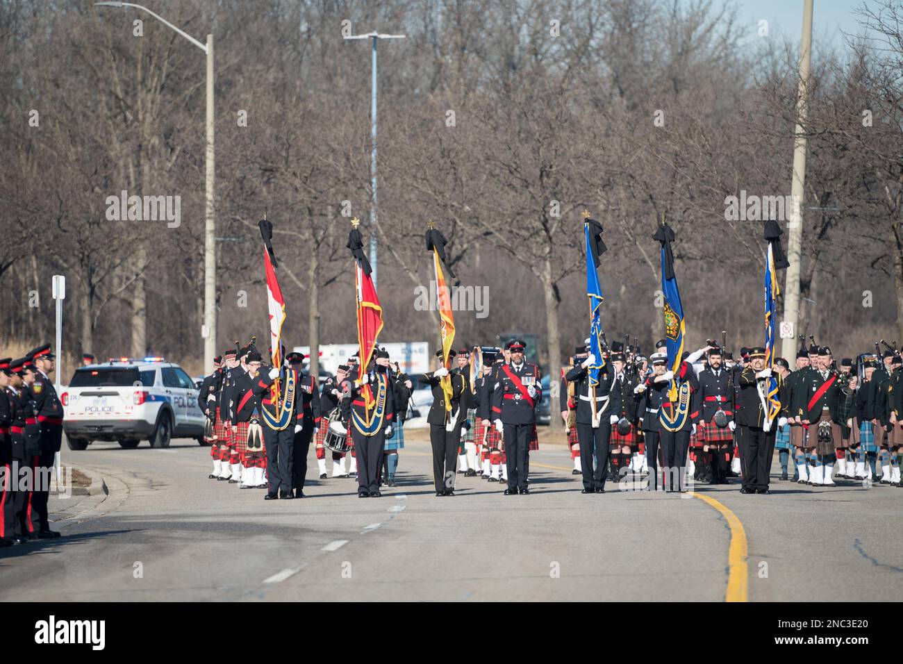 The procession waits for the motorcade during the state funeral for ...