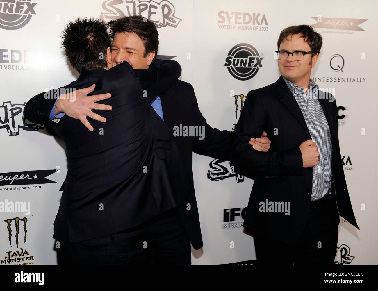 Nathan Fillion, second from left, a cast member in "Super," gets a hug ...