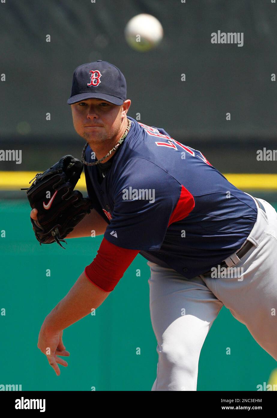Boston Red Sox pitcher Jon Lester warms up before the second inning of ...