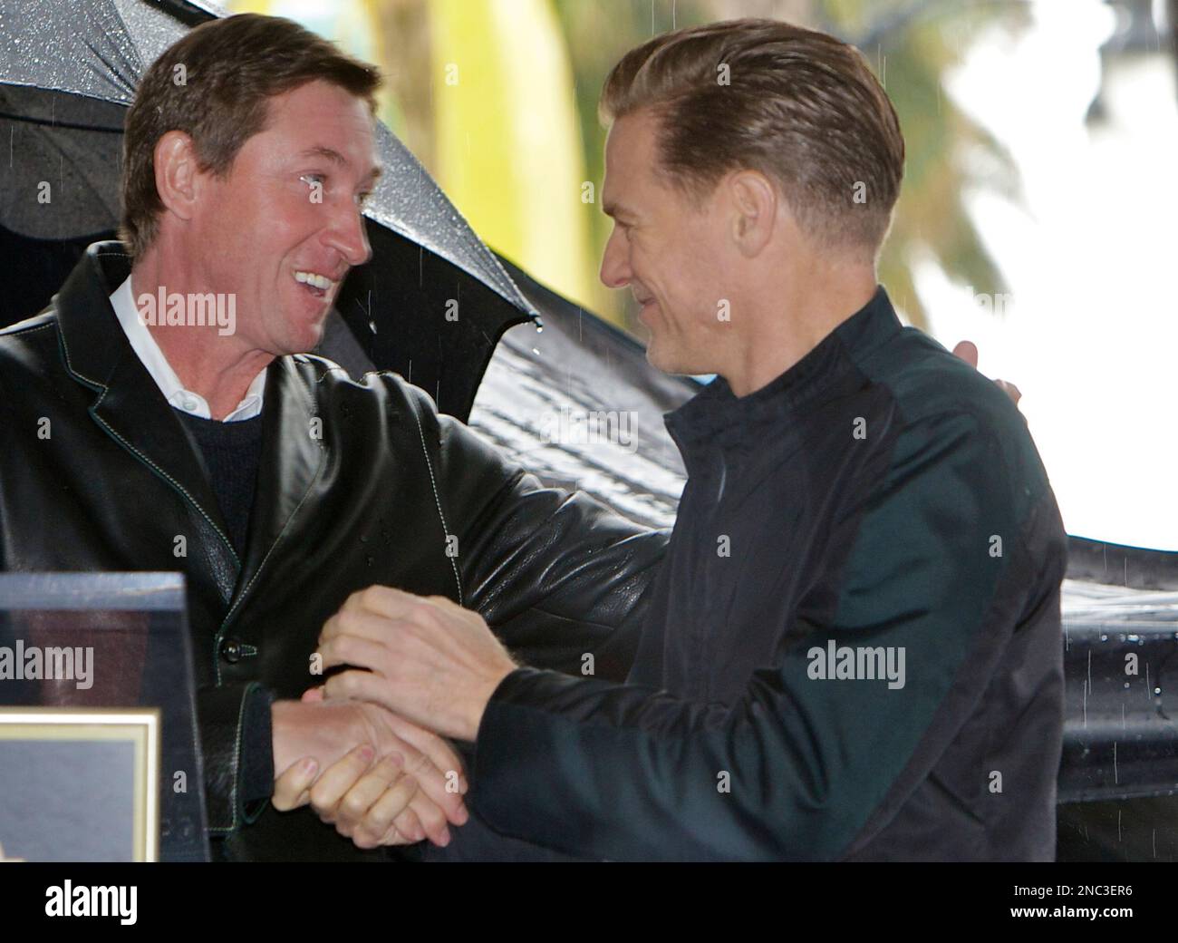 Hockey great Wayne Gretzky, left, congratulates his Canadian friend ...