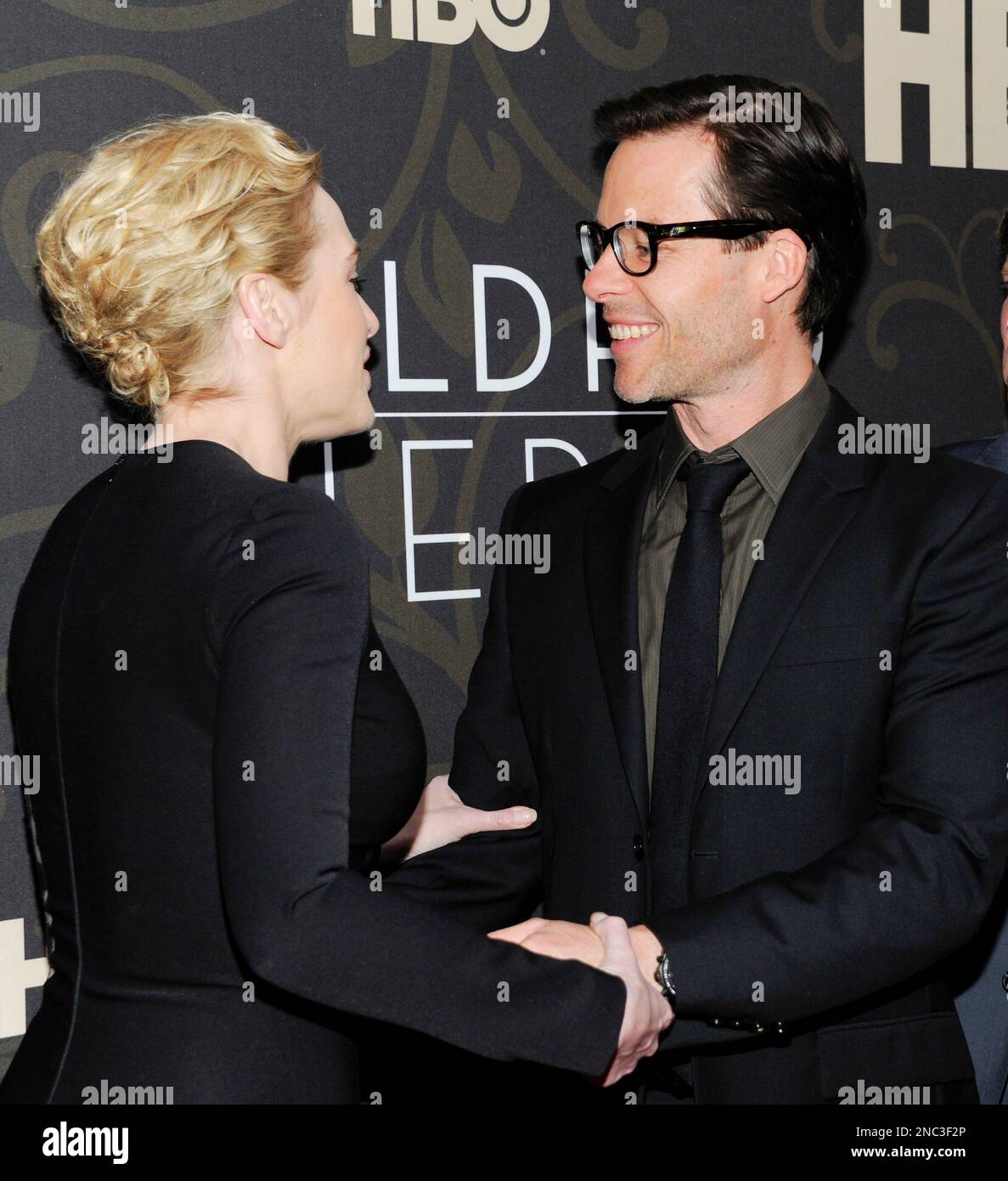 Actor Guy Pearce, right, greets actress Kate Winslet at the premiere of ...