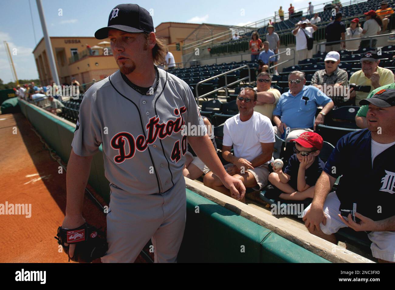 Detroit Tigers pitcher Phil Coke walks away after giving a ball to a ...