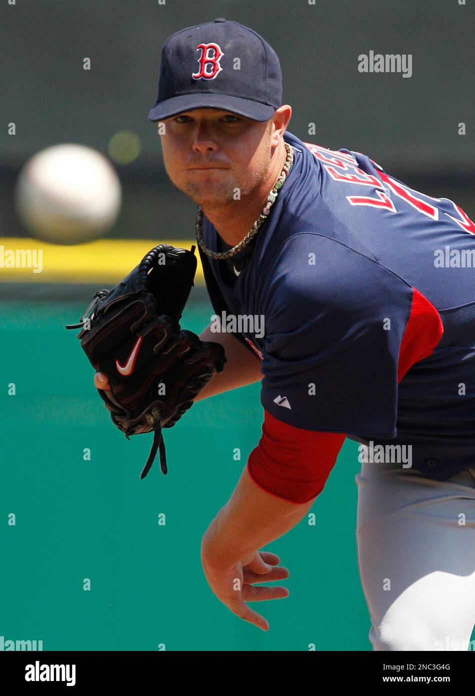 Boston Red Sox pitcher Jon Lester warms up before the second inning of ...
