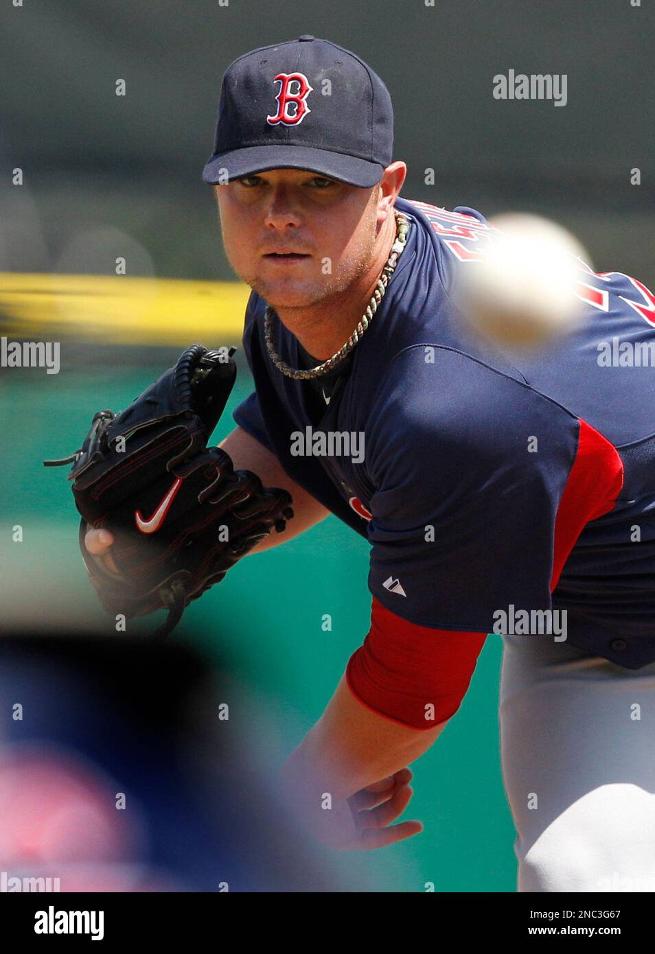Boston Red Sox pitcher Jon Lester warms up before the second inning of ...