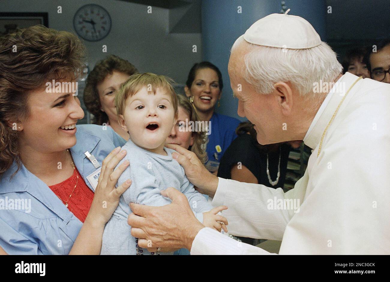 Wide-eyed and surprised by the attention, 16-month-old Angelina Tsukas ...