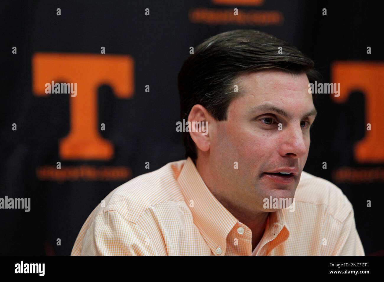Tennessee head football coach Derek Dooley answers questions at a news ...