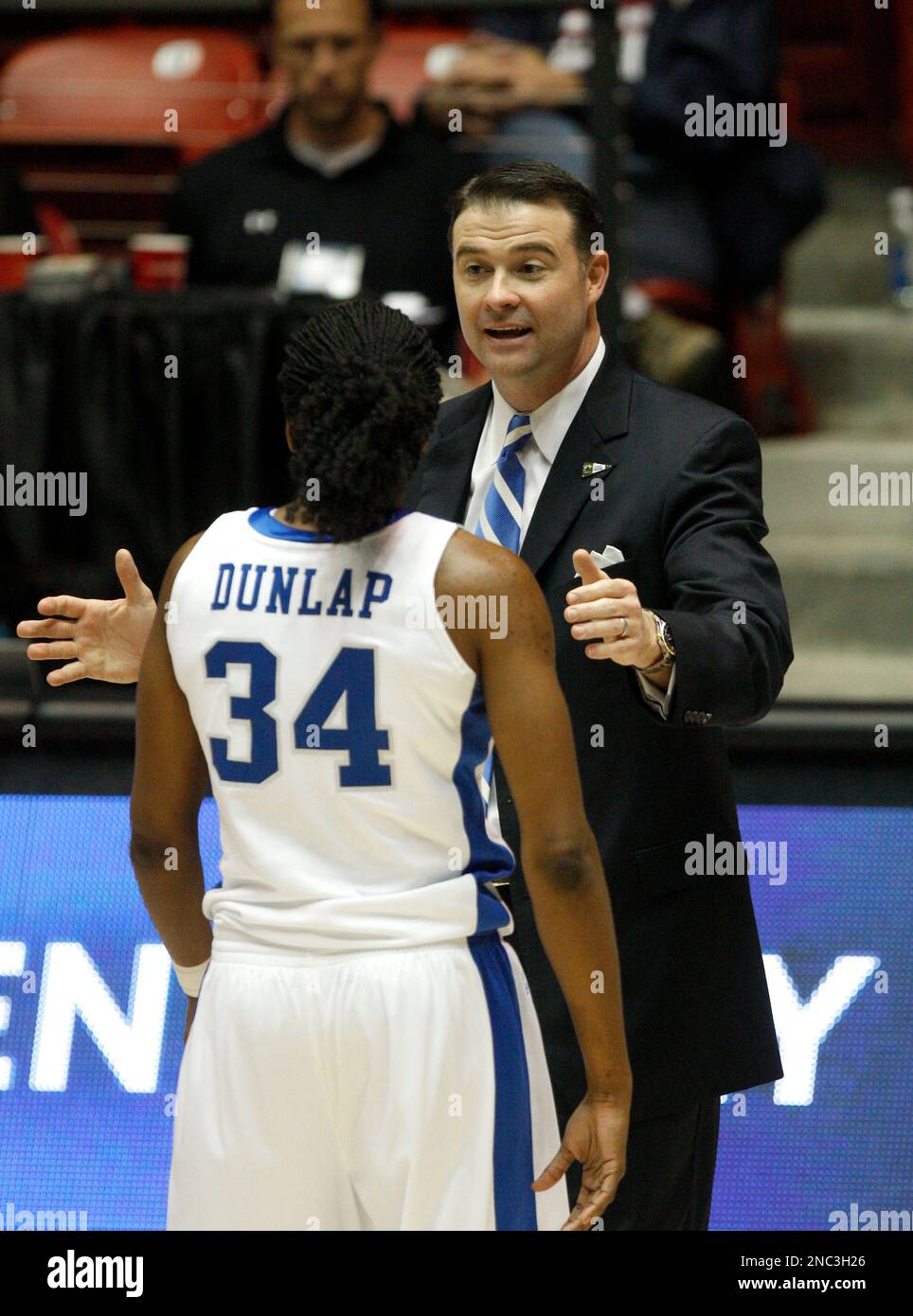 Kentucky head coach Matthew Mitchell talks with player Victoria Dunlap ...