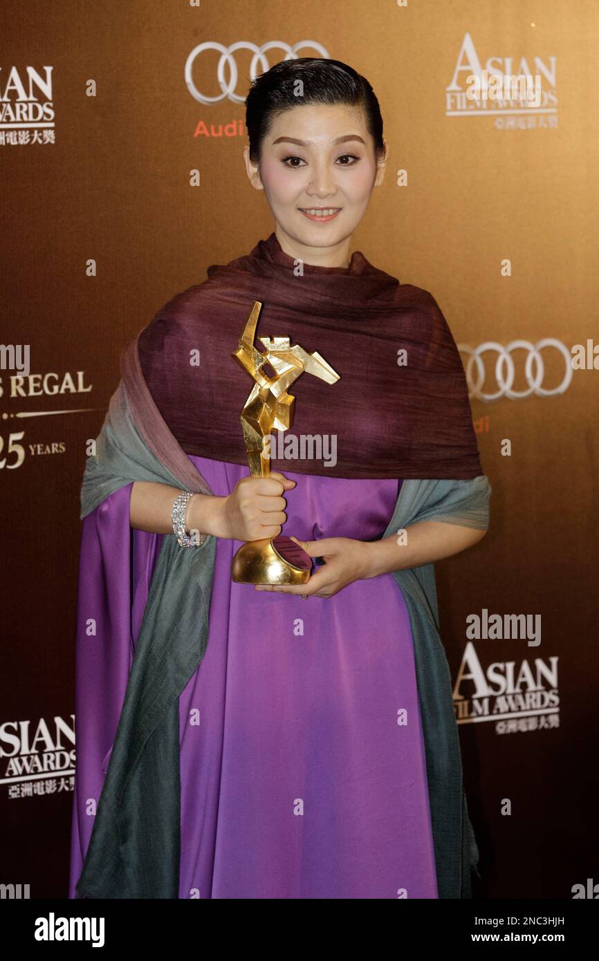 Chinese actress Xu Fan holds the trophy after winning the best actress ...