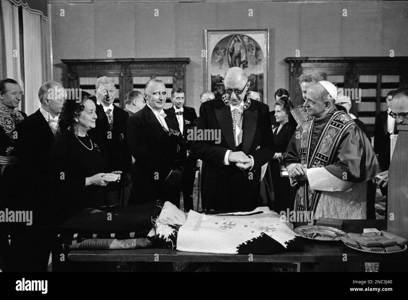 French President Charles De Gaulle, center, shows Pope Paul VI two ...