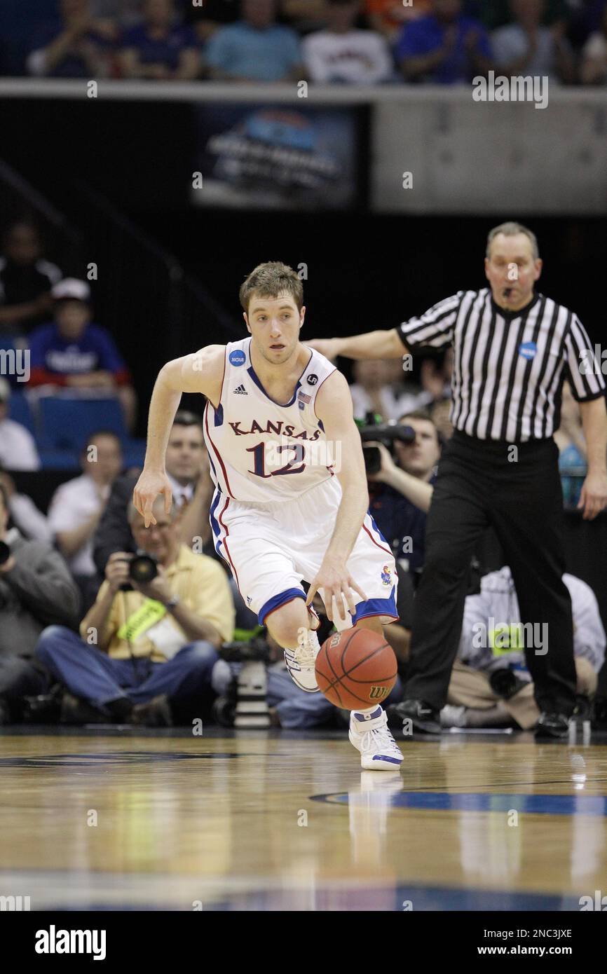 Kansas Brady Morningstar takes the ball down court during the second ...