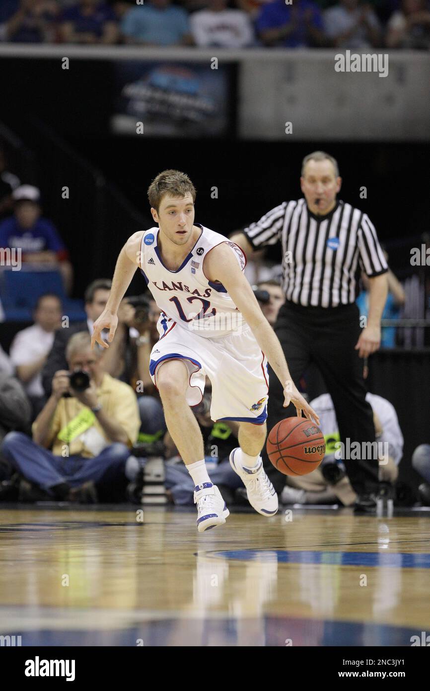 Kansas Brady Morningstar takes the ball down court during the second ...
