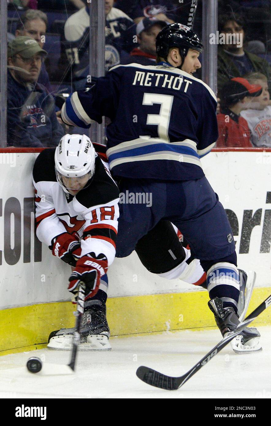 Columbus Blue Jackets' Marc Methot, right, checks New Jersey Devils ...