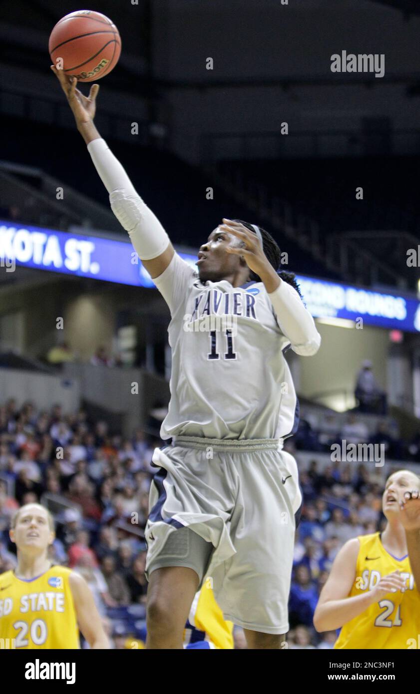 Xavier forward Amber Harris (11) drives between South Dakota State ...