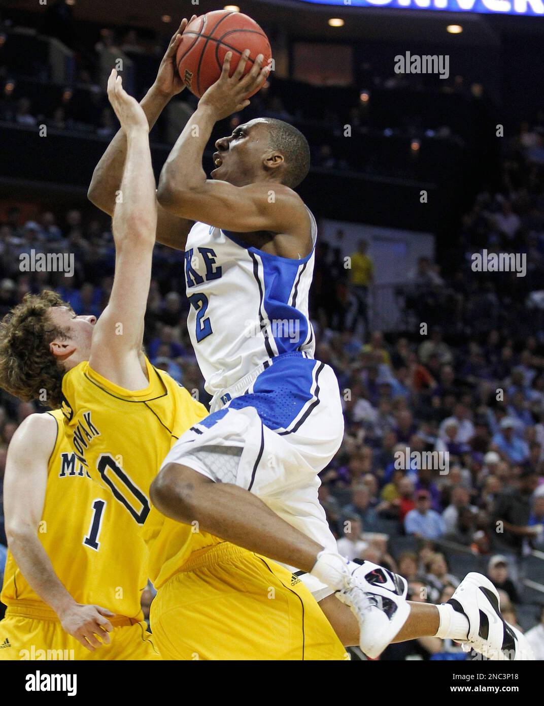 Duke guard Nolan Smith (2) shoots as Michigan's Zack Novak (0) falls ...