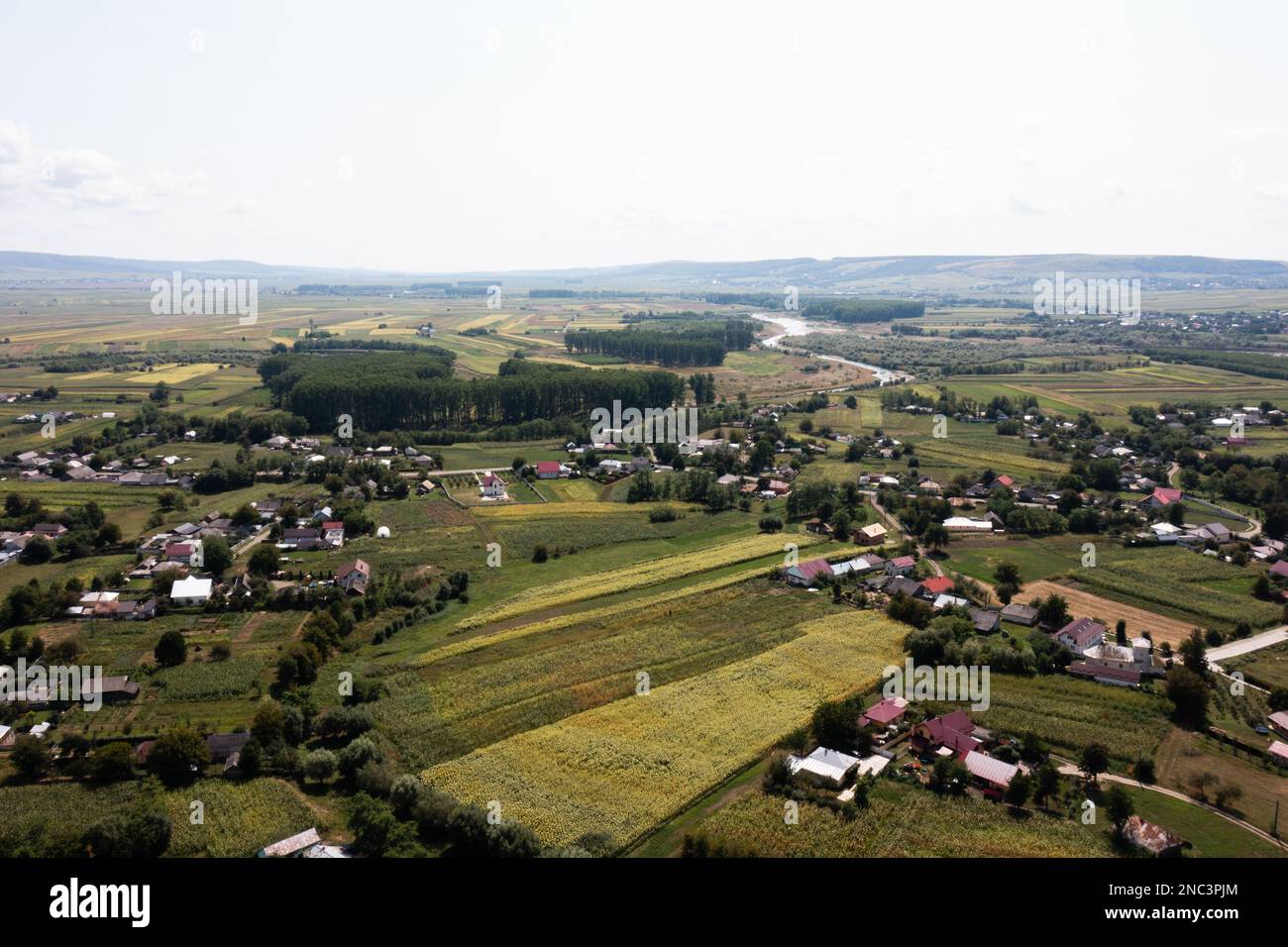An aerial landscape in a village with farm lands Stock Photo - Alamy