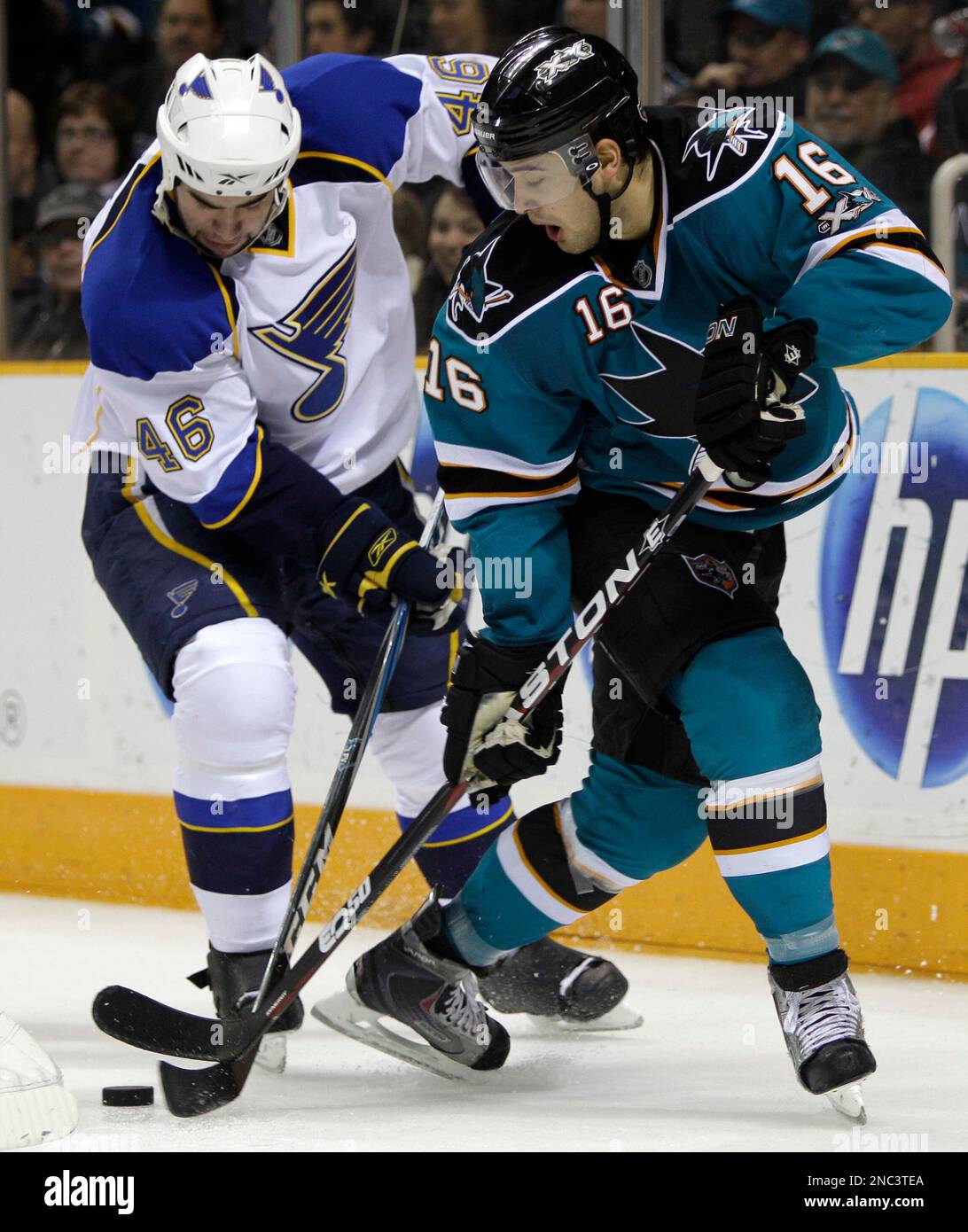 St. Louis Blues' Roman Polak, left, and San Jose Sharks' Devin ...