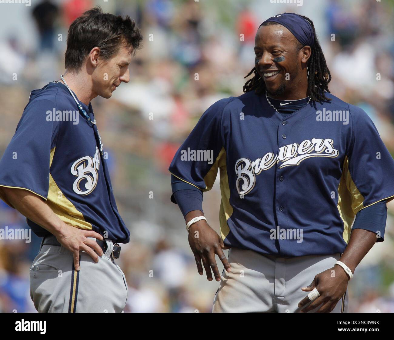 Milwaukee Brewers' Rickie Weeks, right, smiles as he talks to Craig ...