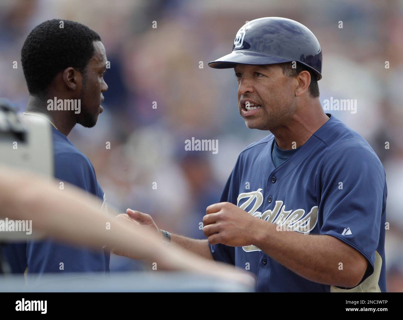 San Diego Padres first base coach Dave Roberts talks with Padres center ...