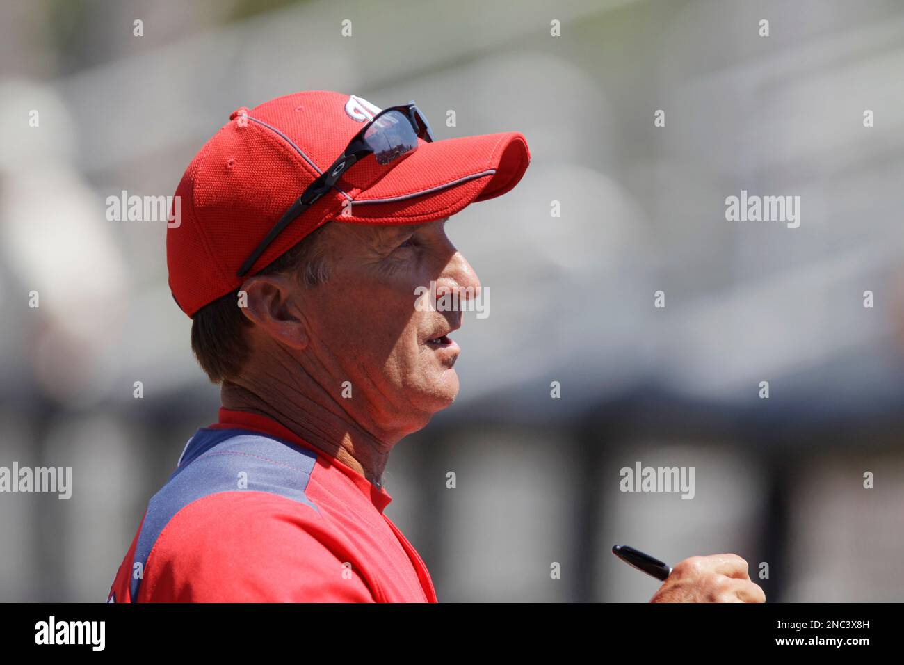 Washington Nationals manager Jim Riggleman signs autographs before a ...