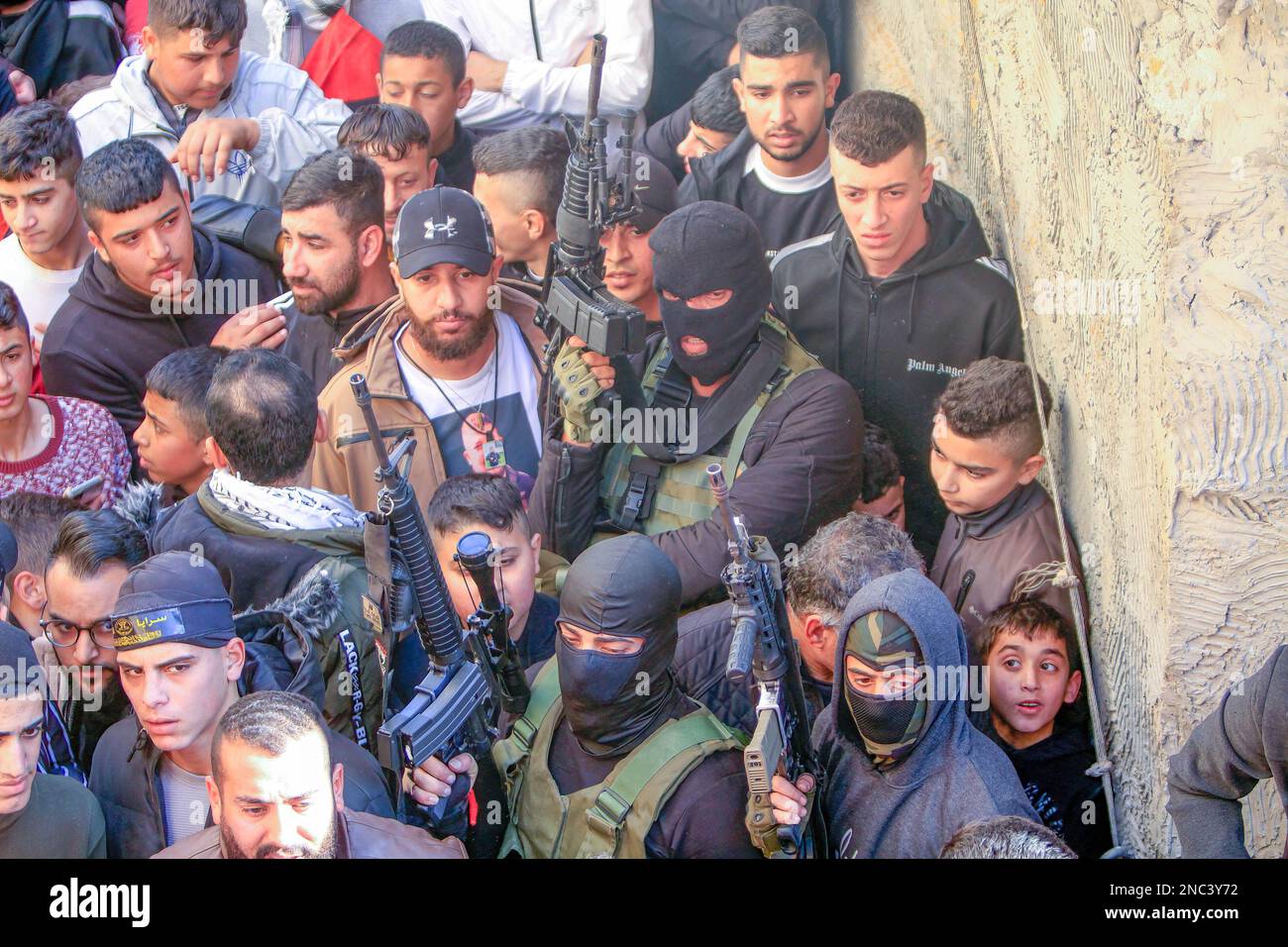 Jenin, Palestine. 14th Feb, 2023. Masked Palestinian gunmen take part ...