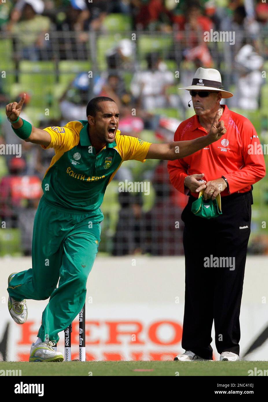 South Africa's bowler Robin Petersen, left, celebrates a wicket as ...