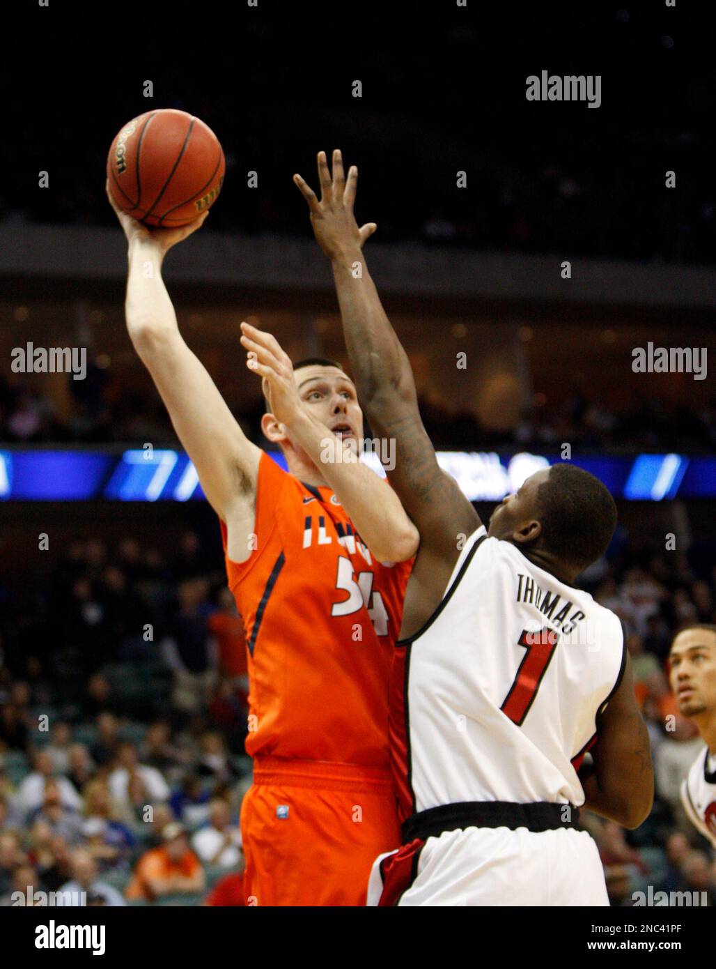 Illinois' Mike Tisdale shoots over UNLV's Quintrell Thomas in the first ...