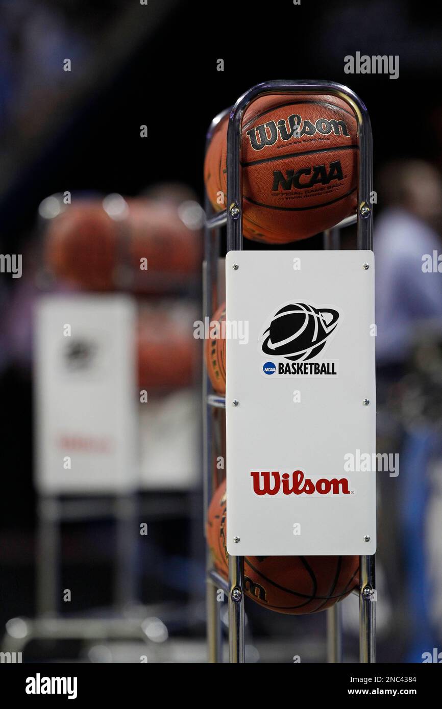 Basketballs stand on the floor in thier racks before an East Regional ...