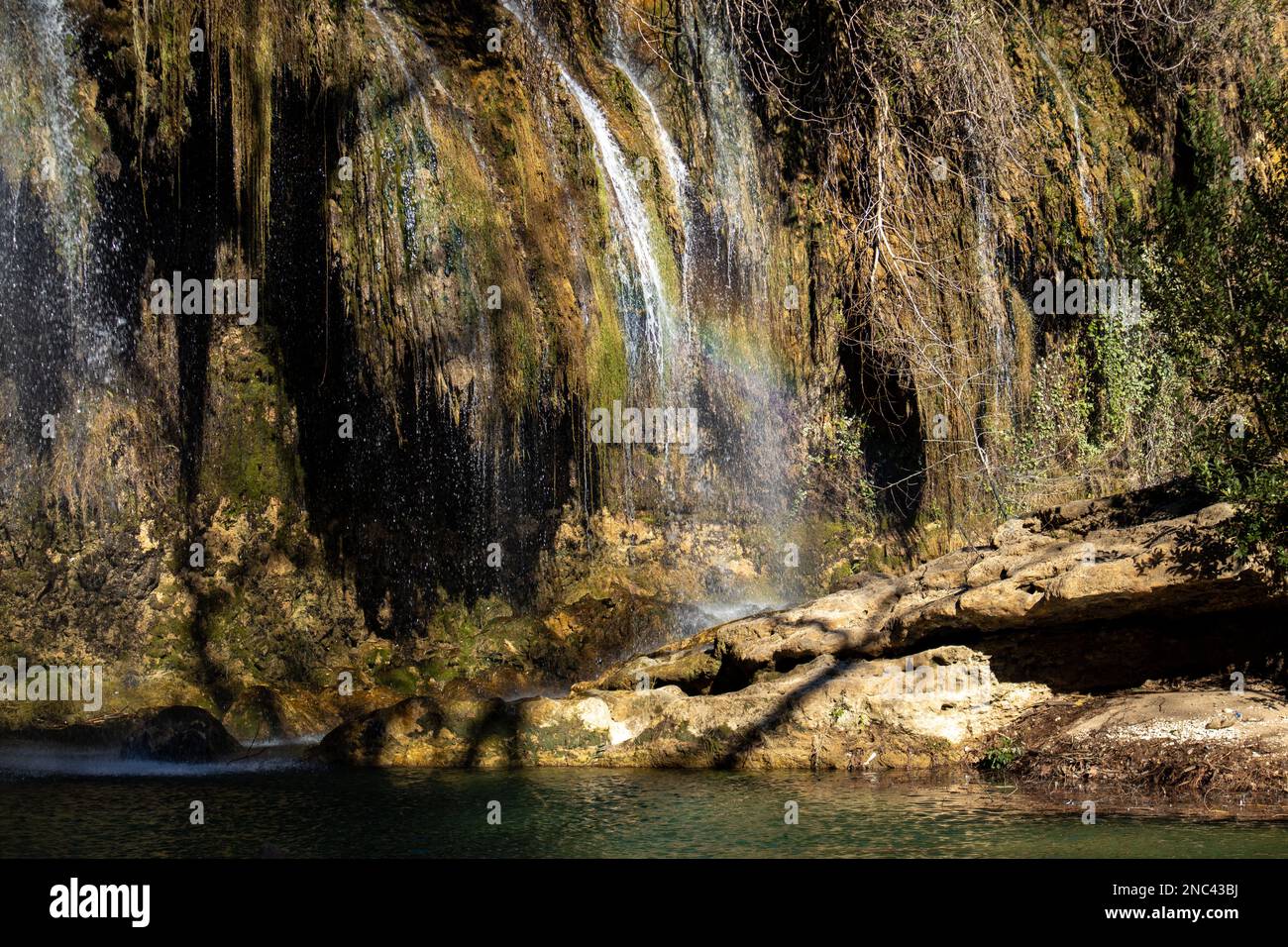 View of a mountain lake and waterfall Stock Photo - Alamy