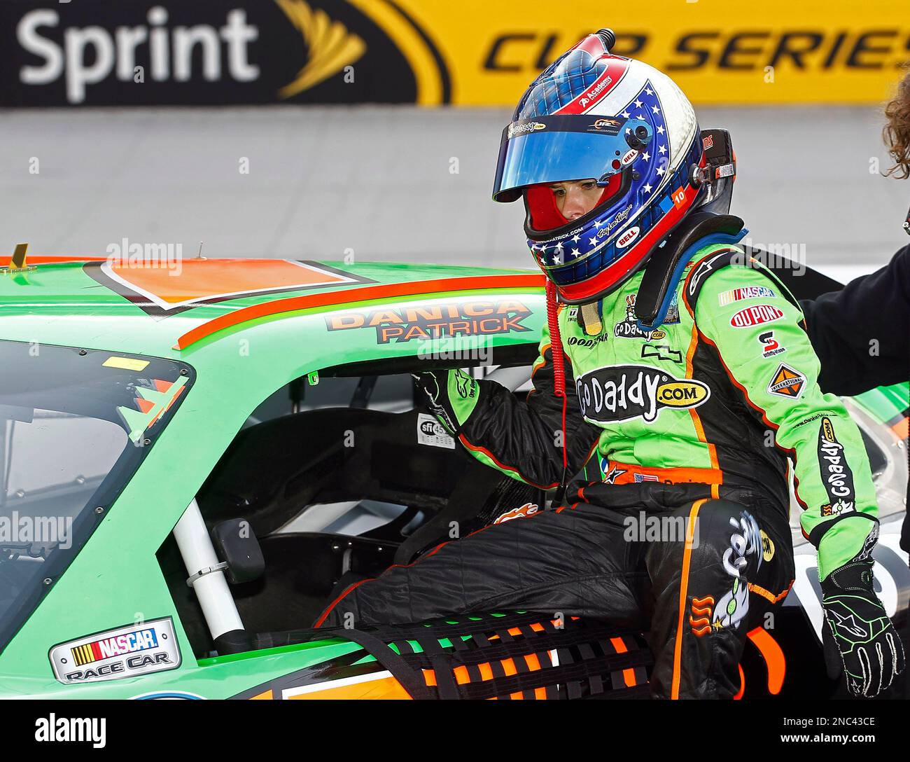 Driver Danica Patrick climbs from her car after practice for the NASCAR ...