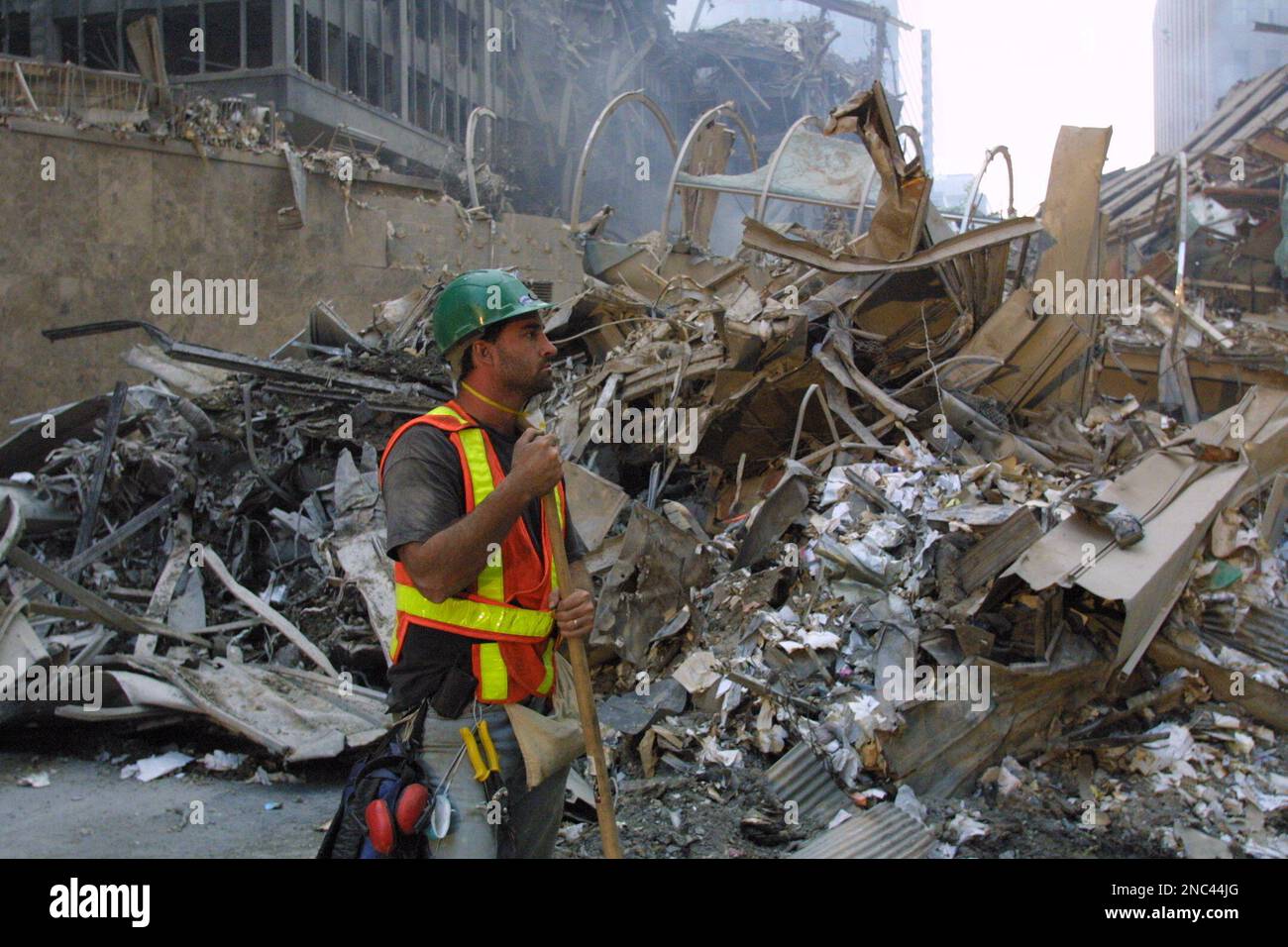 In this September 14, 2001 photograph, a worker observes the rubble at ...