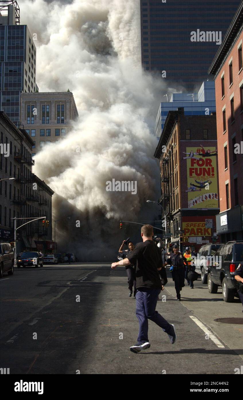 The south tower of the World Trade Center's twin towers collapses after ...