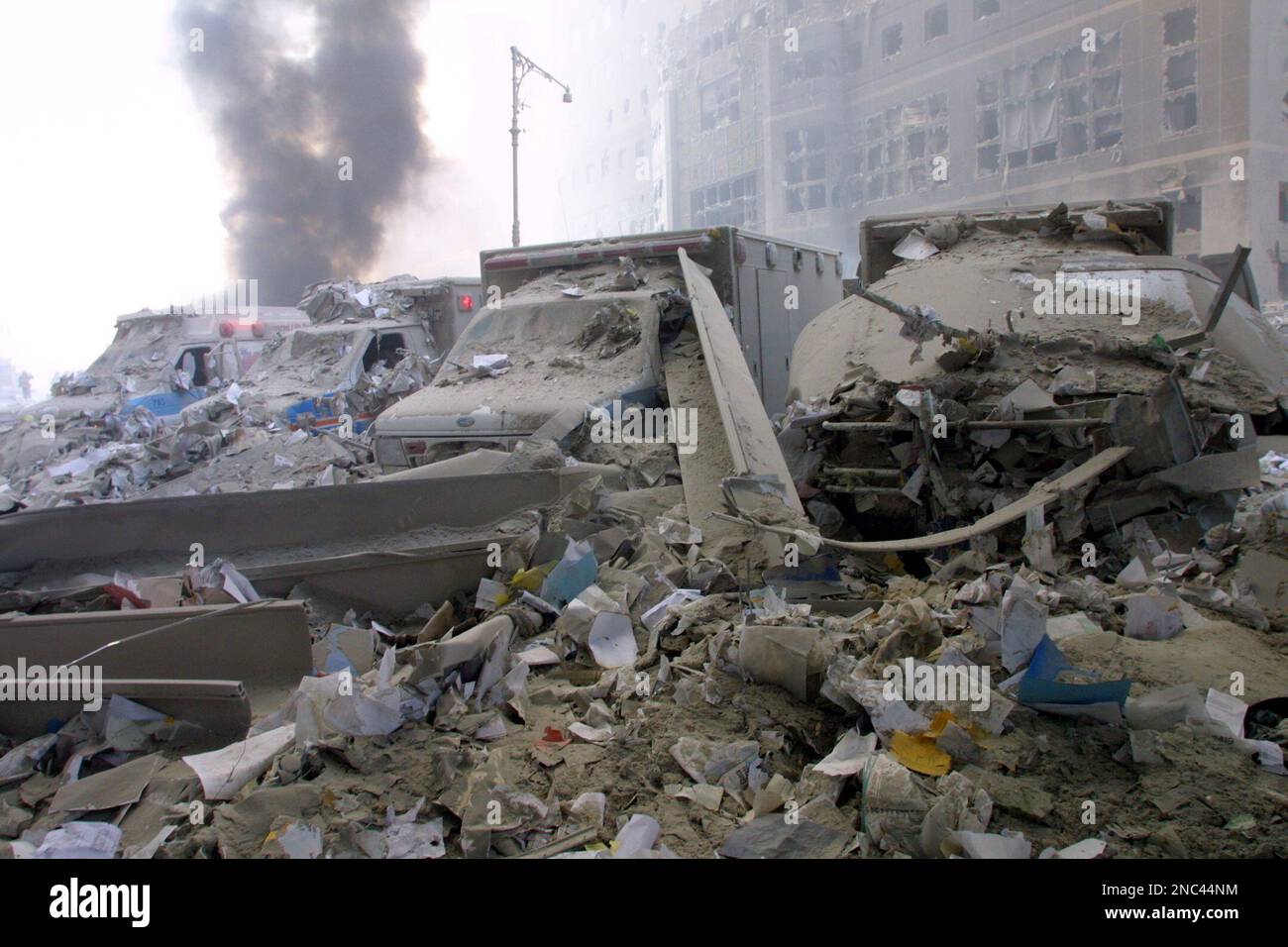 Ambulances are buried under rubble in the aftermath of the September 11 ...
