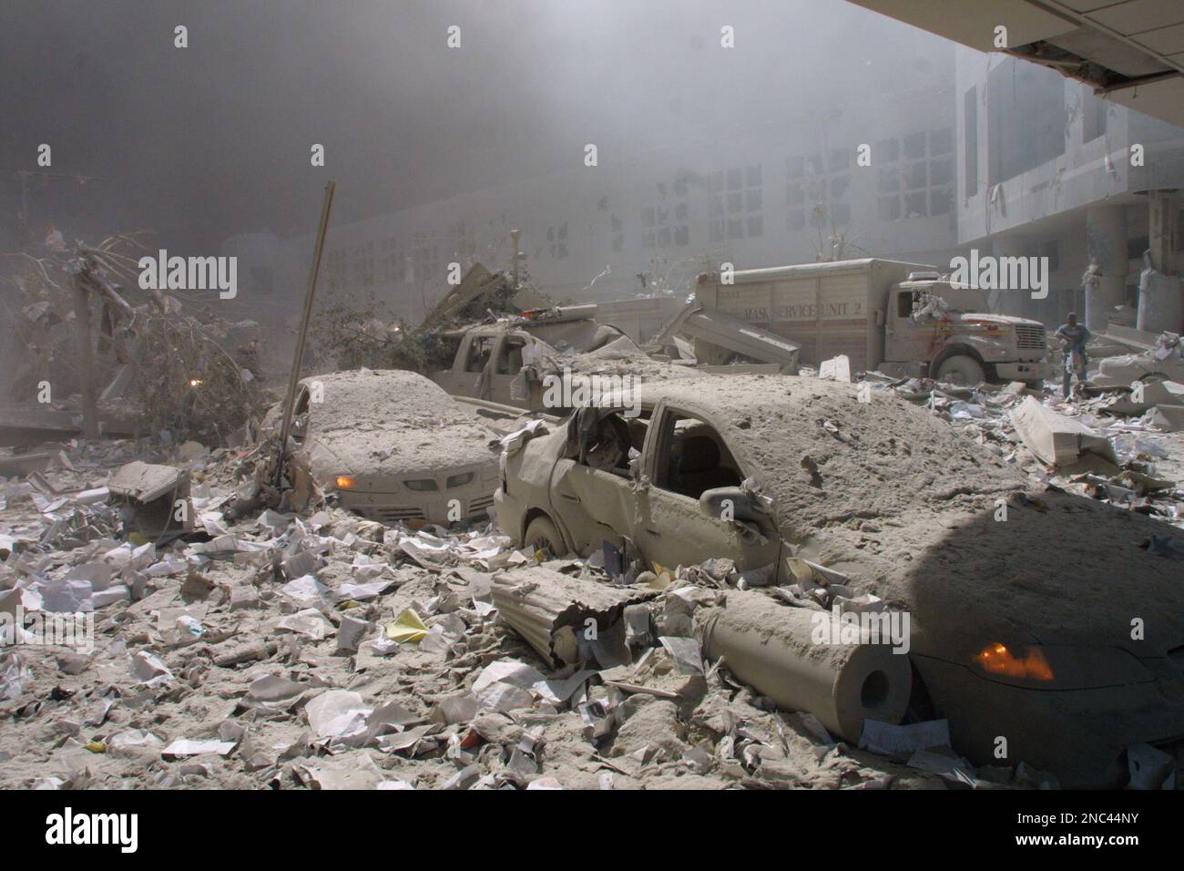 Cars are buried under debris in the aftermath of the September 11 ...