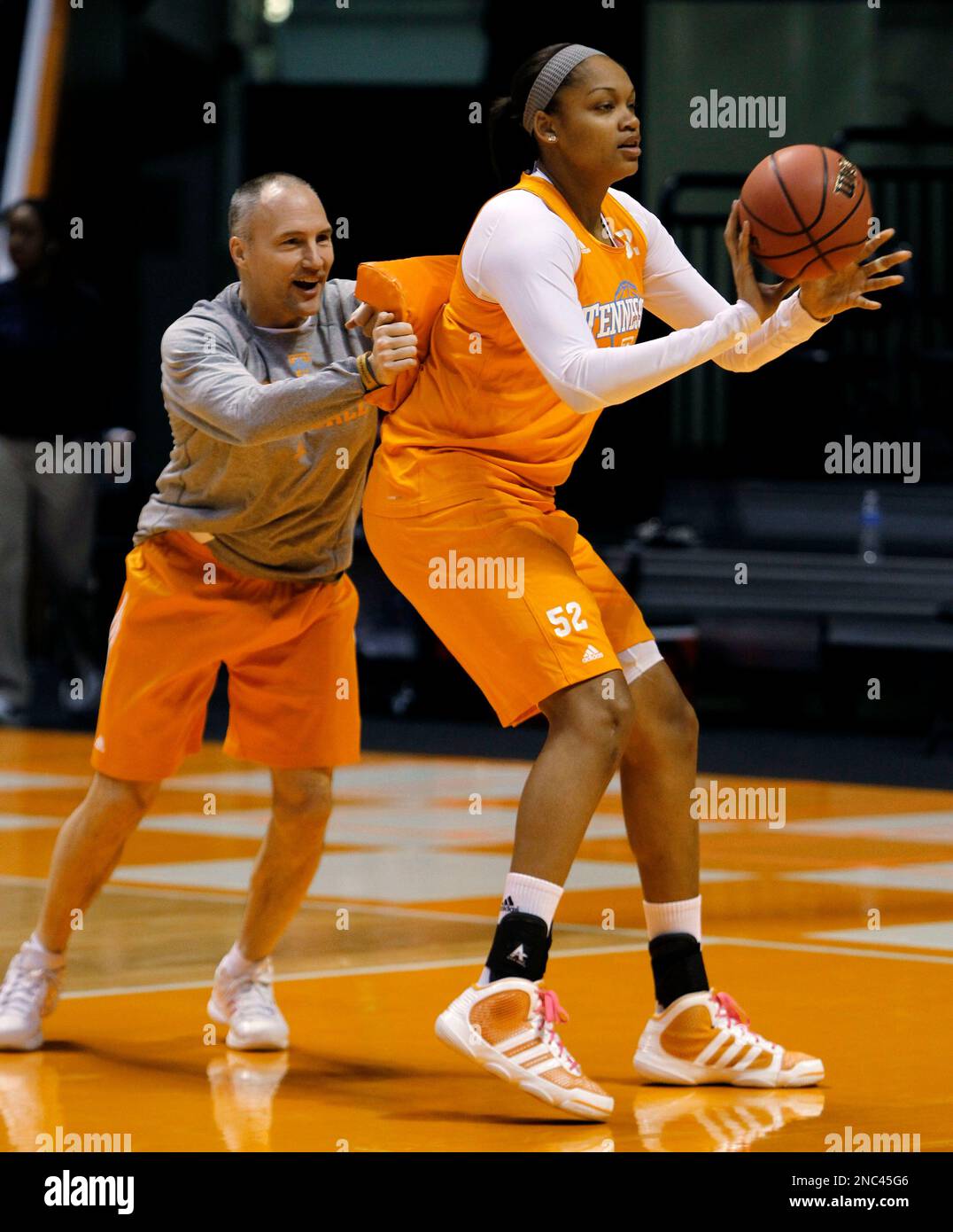 Tennessee center Kelley Cain is defended by assistant coach Dean ...