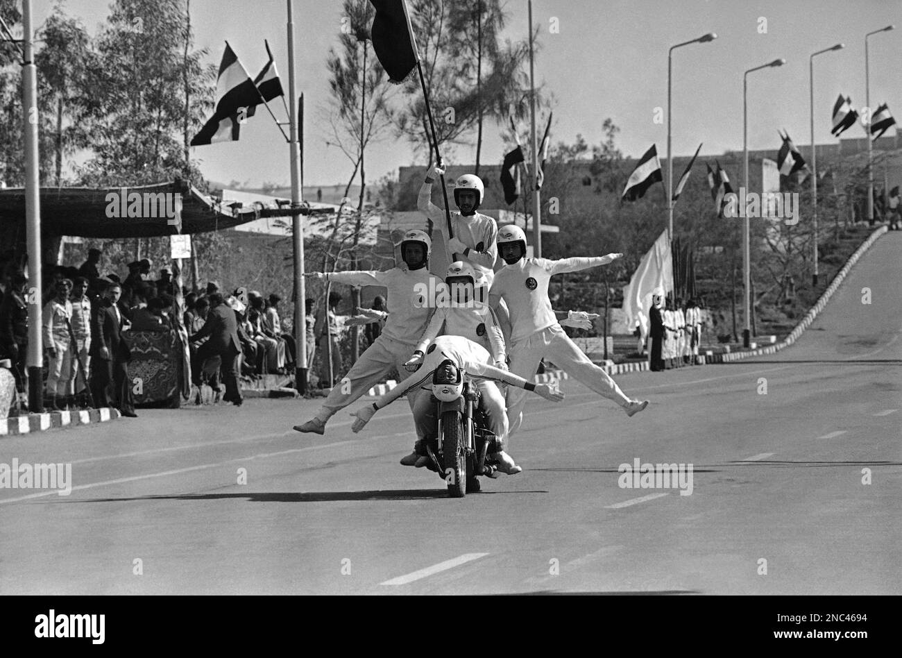 Egyptian police motorcycle team perform balancing trick on police day ...